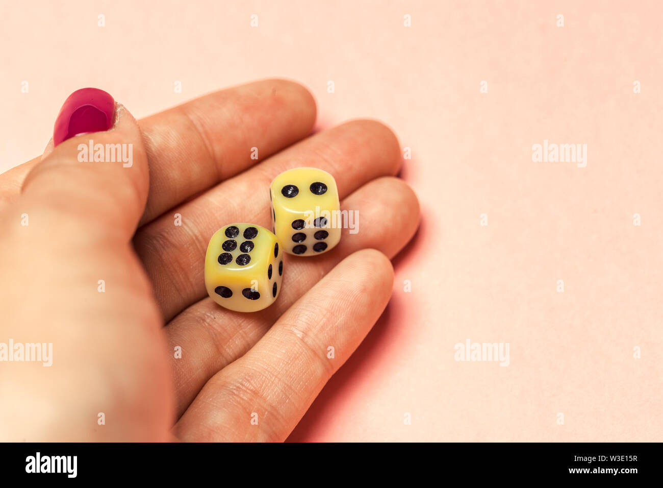 hand with a pair of dice Stock Photo - Alamy
