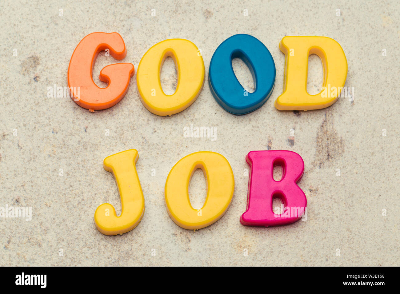 Words Good Job written in colorful plastic letters close up shot Stock ...