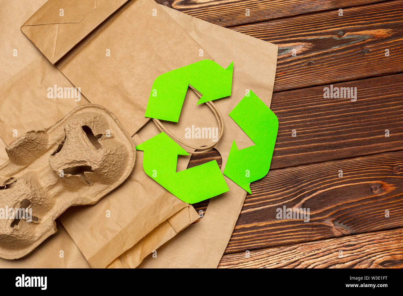 Eco concept with recycling symbol on table background top view Stock ...