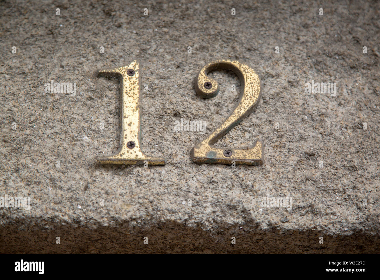 Number Twelve on Stone Wall Facade Stock Photo - Alamy