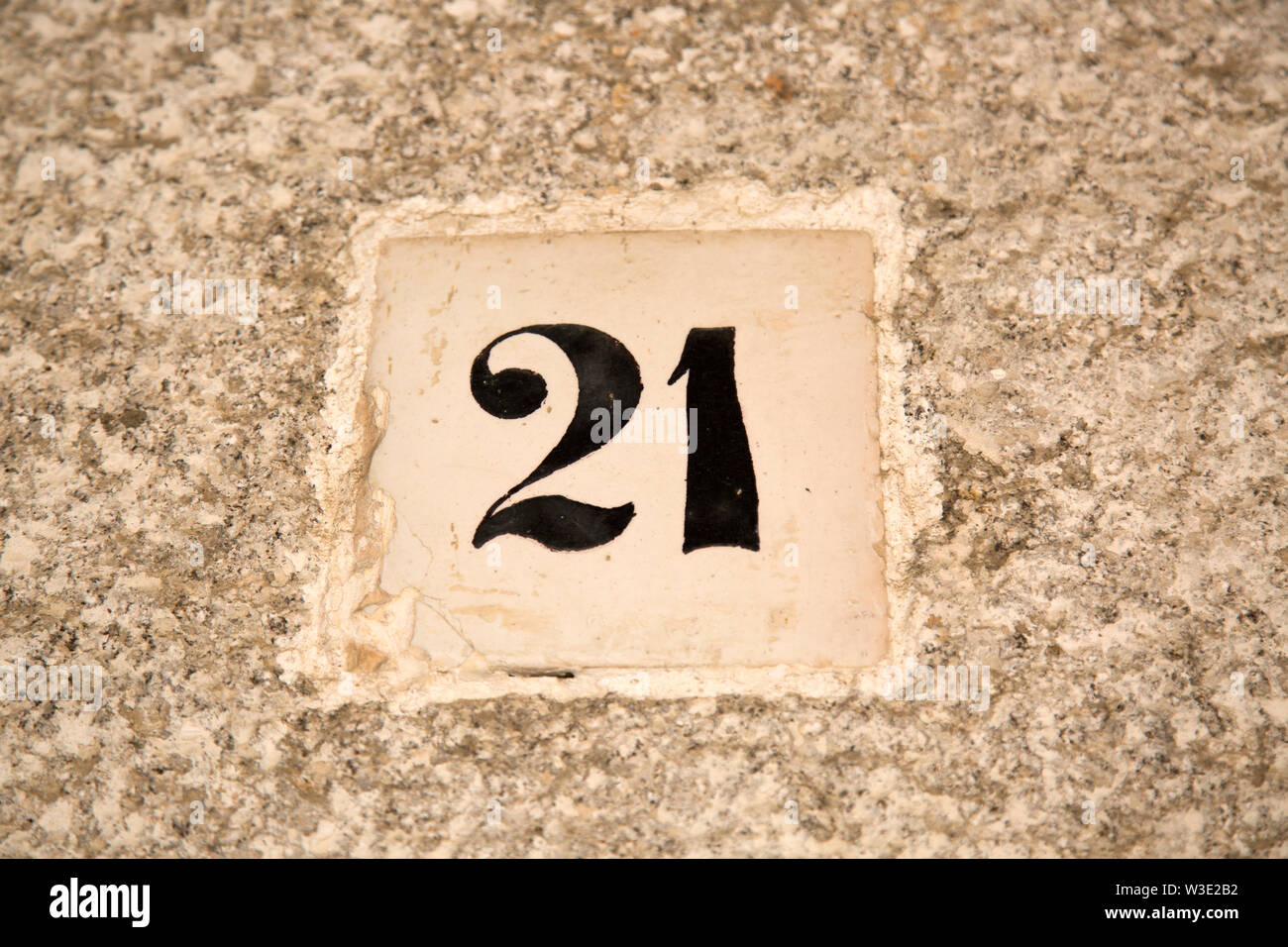 Number Twenty-one on Stone Wall Stock Photo - Alamy