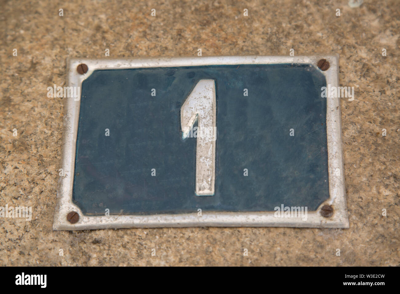 Number One on Stone Wall Stock Photo - Alamy
