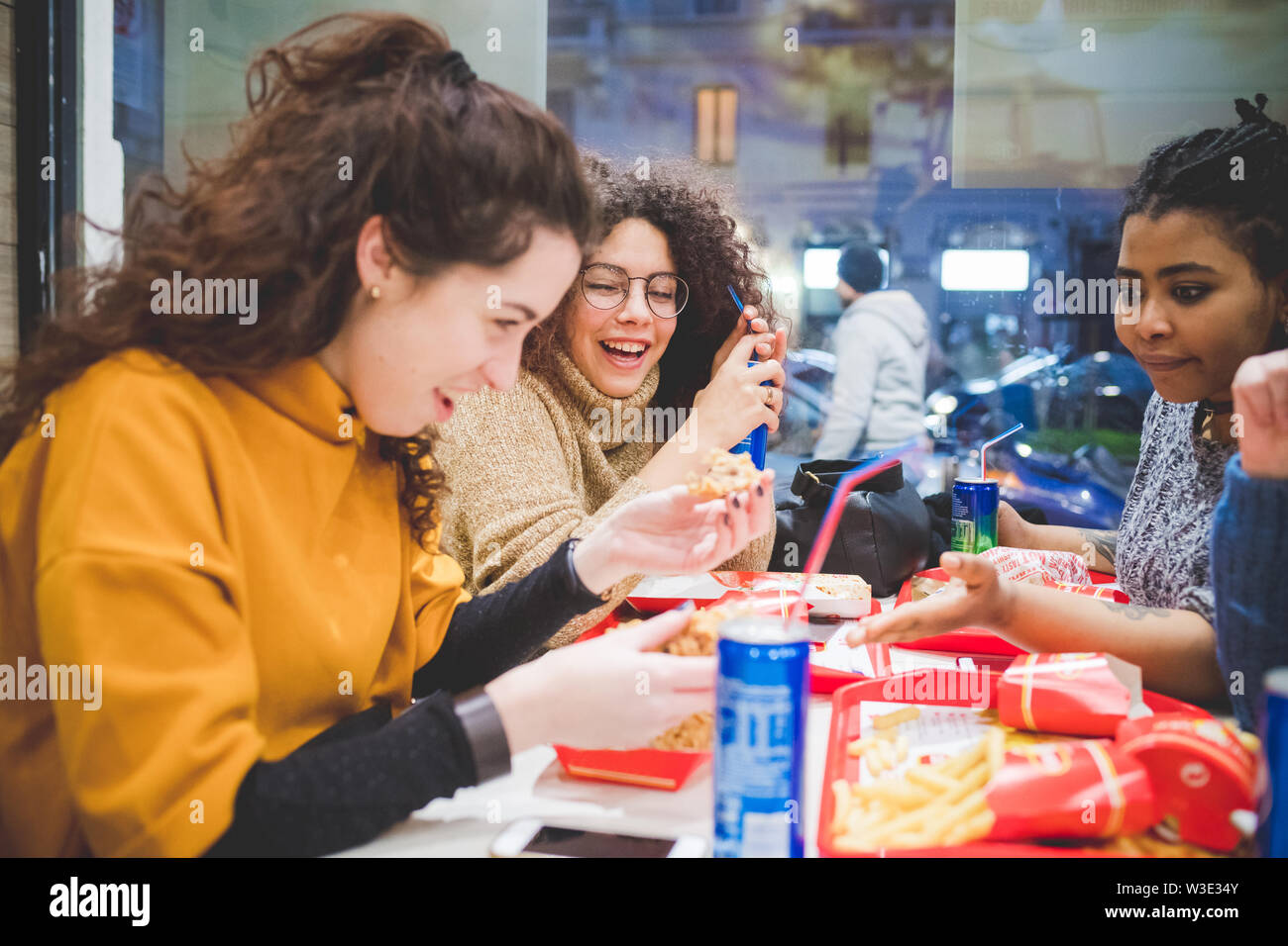 group of girlfriends eating diner in fast food – hungry, break ...