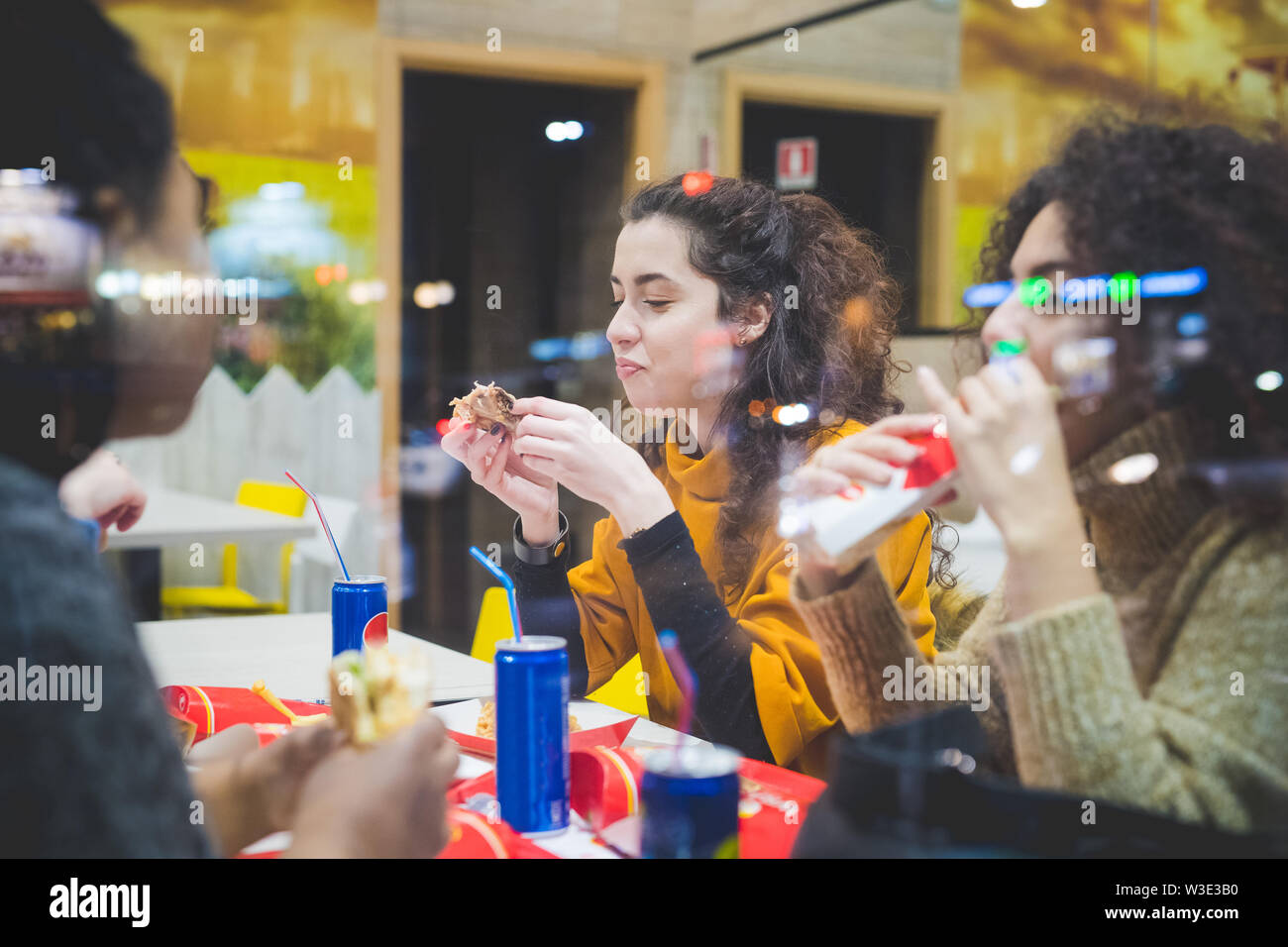 close up of women eating in fast food – break, togetherness, hungry ...
