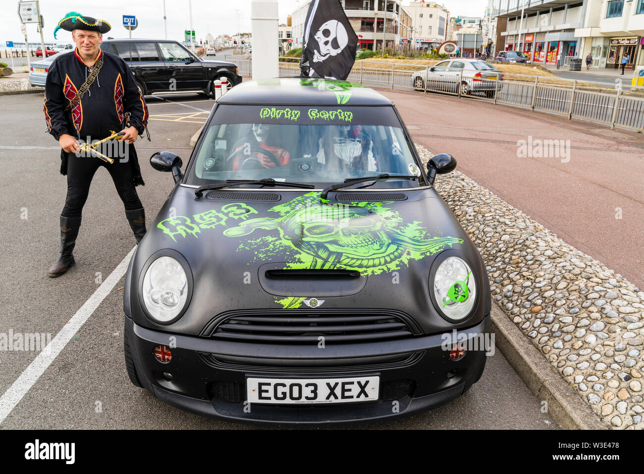 Anthony Frederick poses by his special mini car, Dirty Gery, with a ...