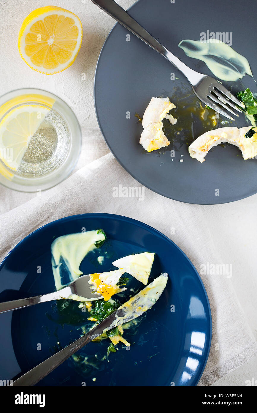 Leftovers breakfast or brunch on the plate with bread crumbs top view ...