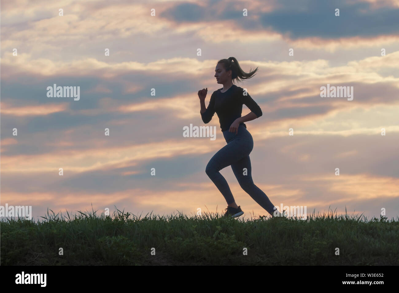 Running woman morning workout. Female Runner. Jogging during sunrise ...