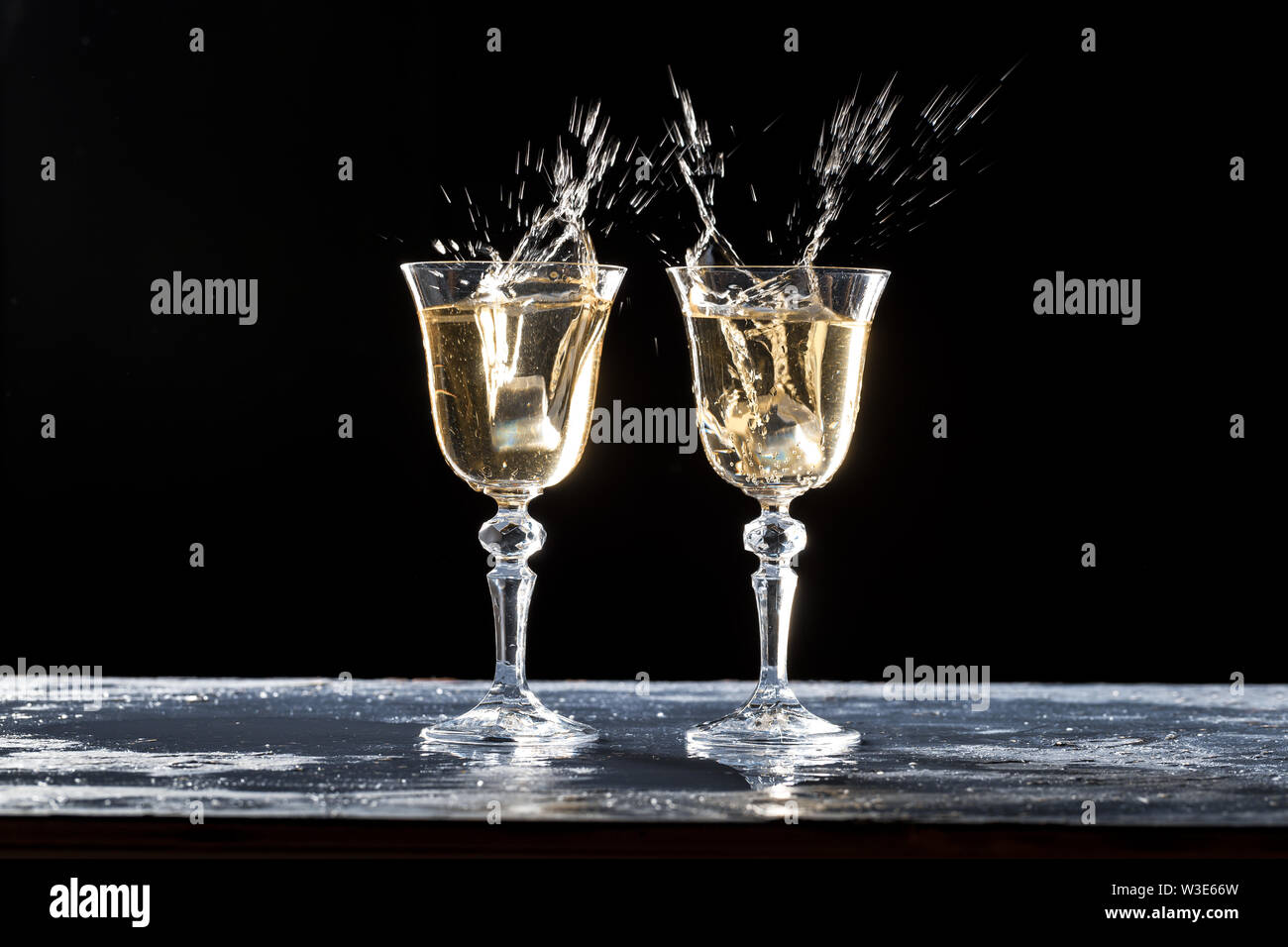 Glasses of champagne with splash Stock Photo - Alamy