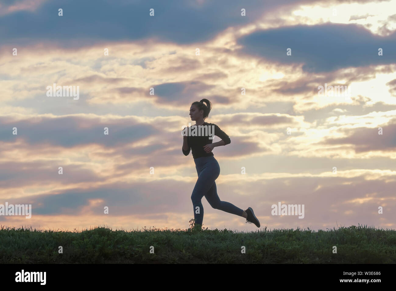 Running woman morning workout. Female Runner. Jogging during sunrise ...