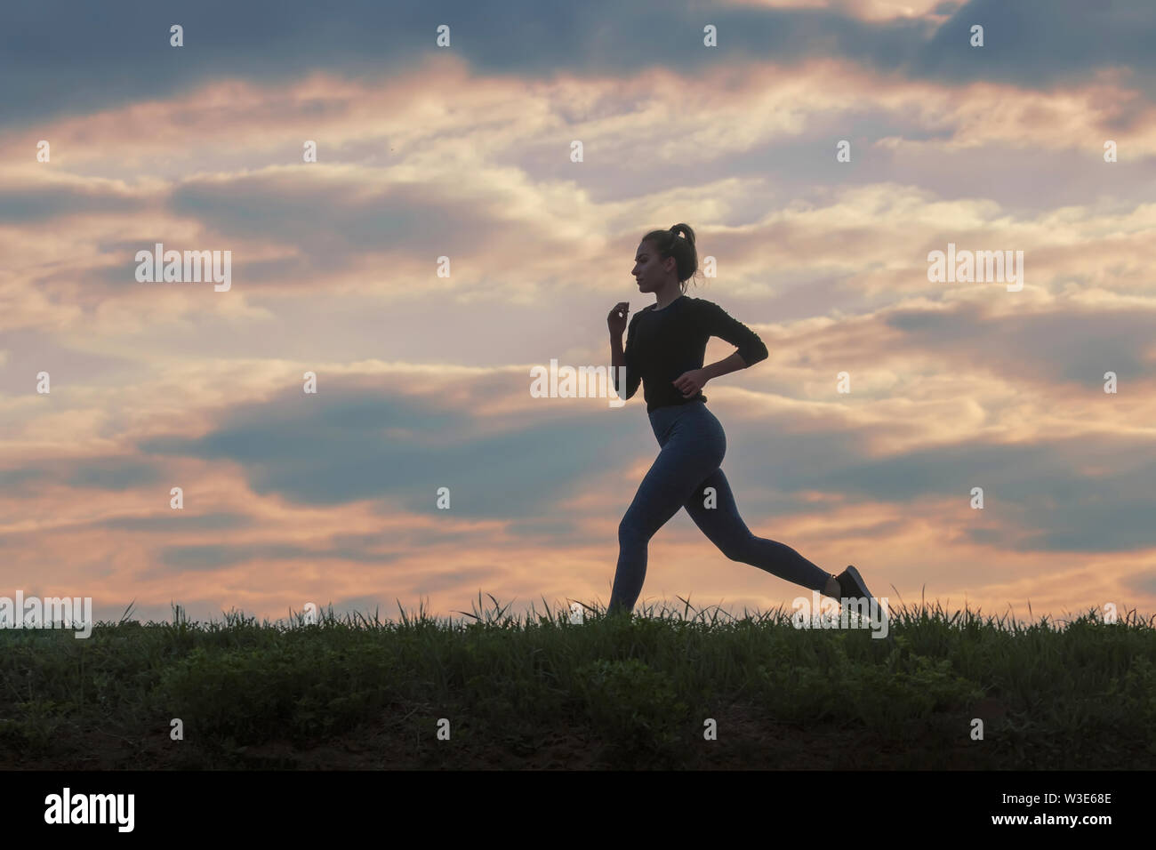 Running woman morning workout. Female Runner. Jogging during sunrise ...
