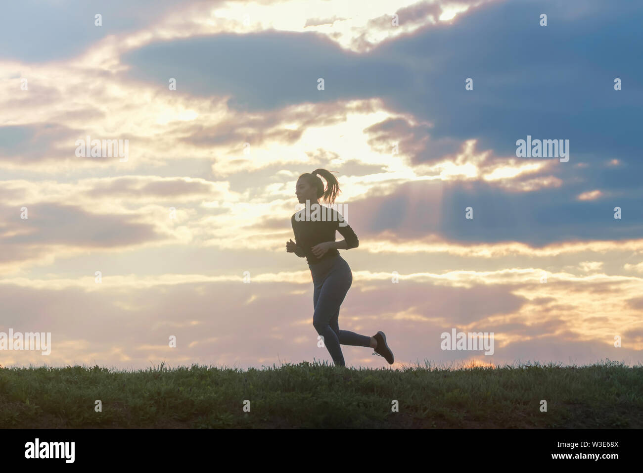 Running woman morning workout. Female Runner. Jogging during sunrise ...