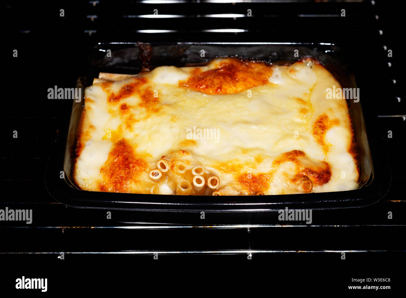 Macaroni cheese ready meal in oven Stock Photo - Alamy