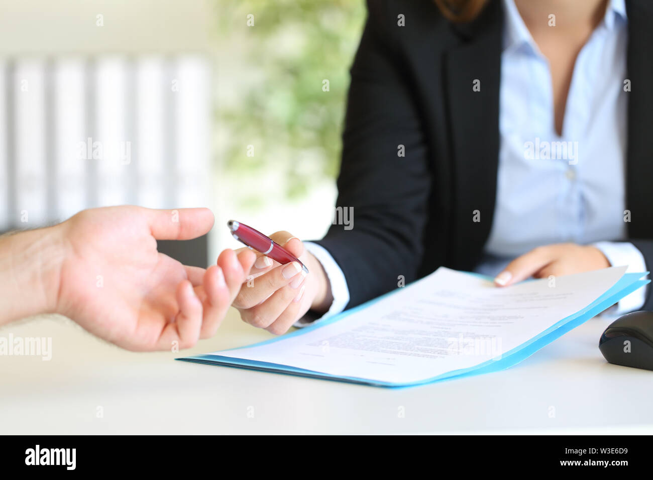 Businessman giving pen client hi-res stock photography and images - Alamy