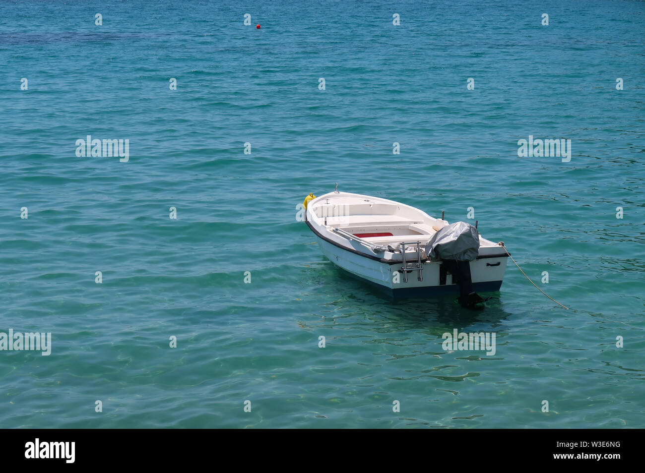 Small fishing boat in the sea Stock Photo - Alamy