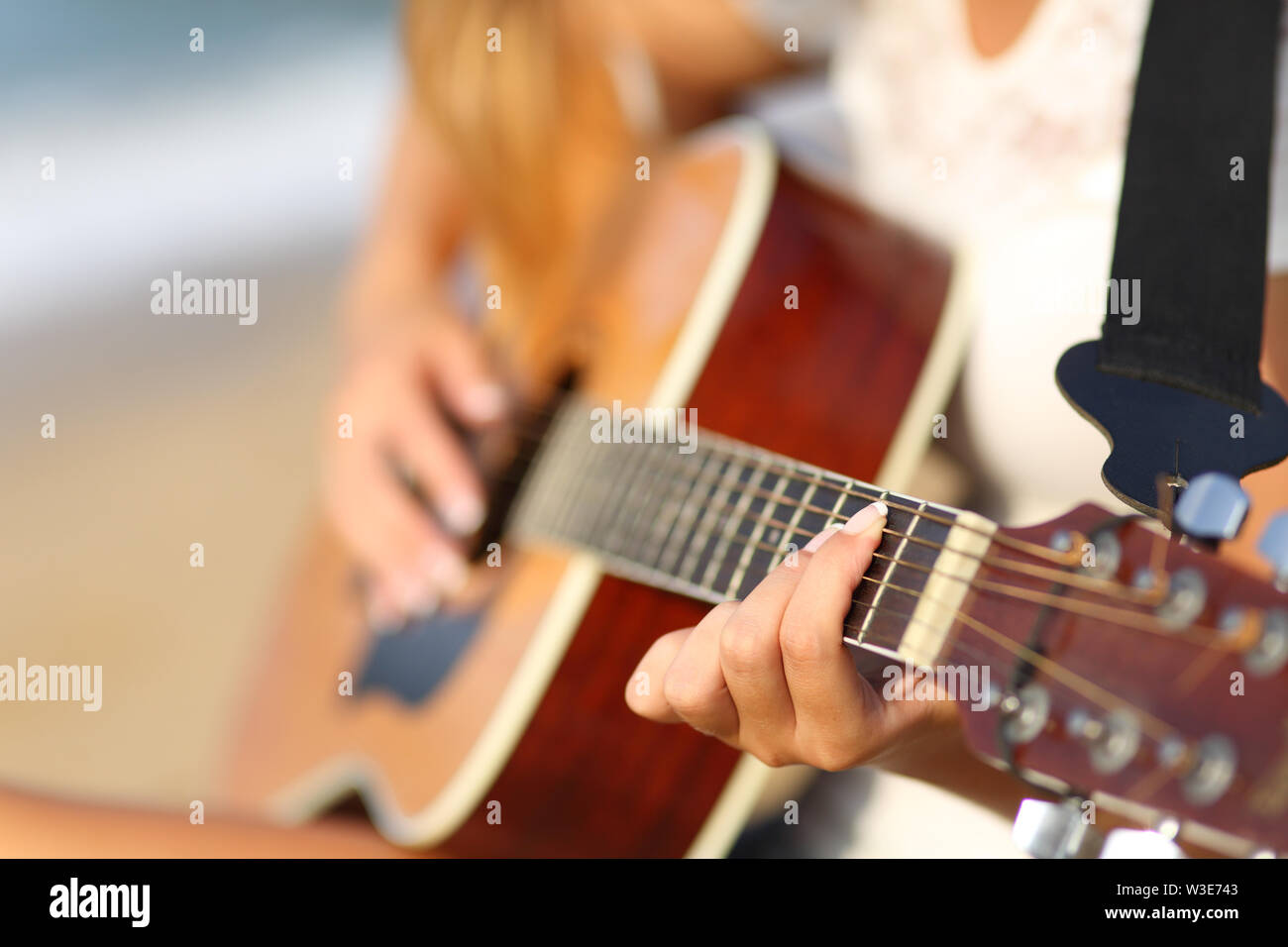 Playing guitar on a beach hi-res stock photography and images - Alamy