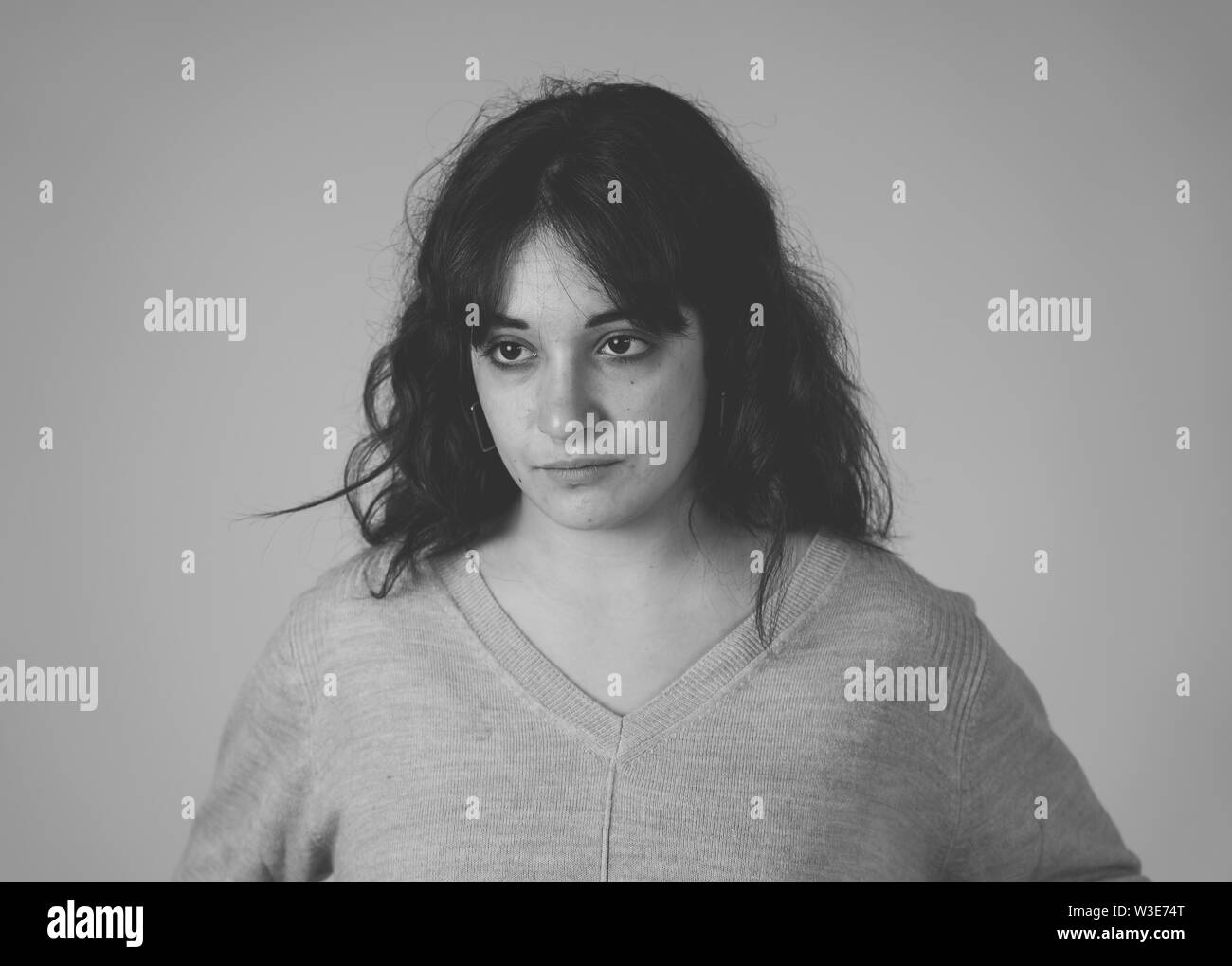 Close up portrait of beautiful young woman with sad eyes looking ...