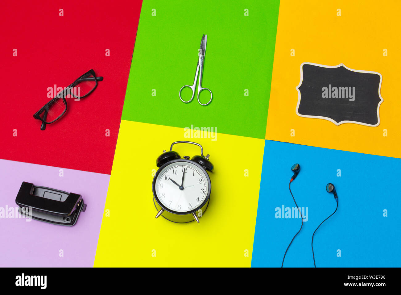 school supplies at colorful paper background Stock Photo - Alamy