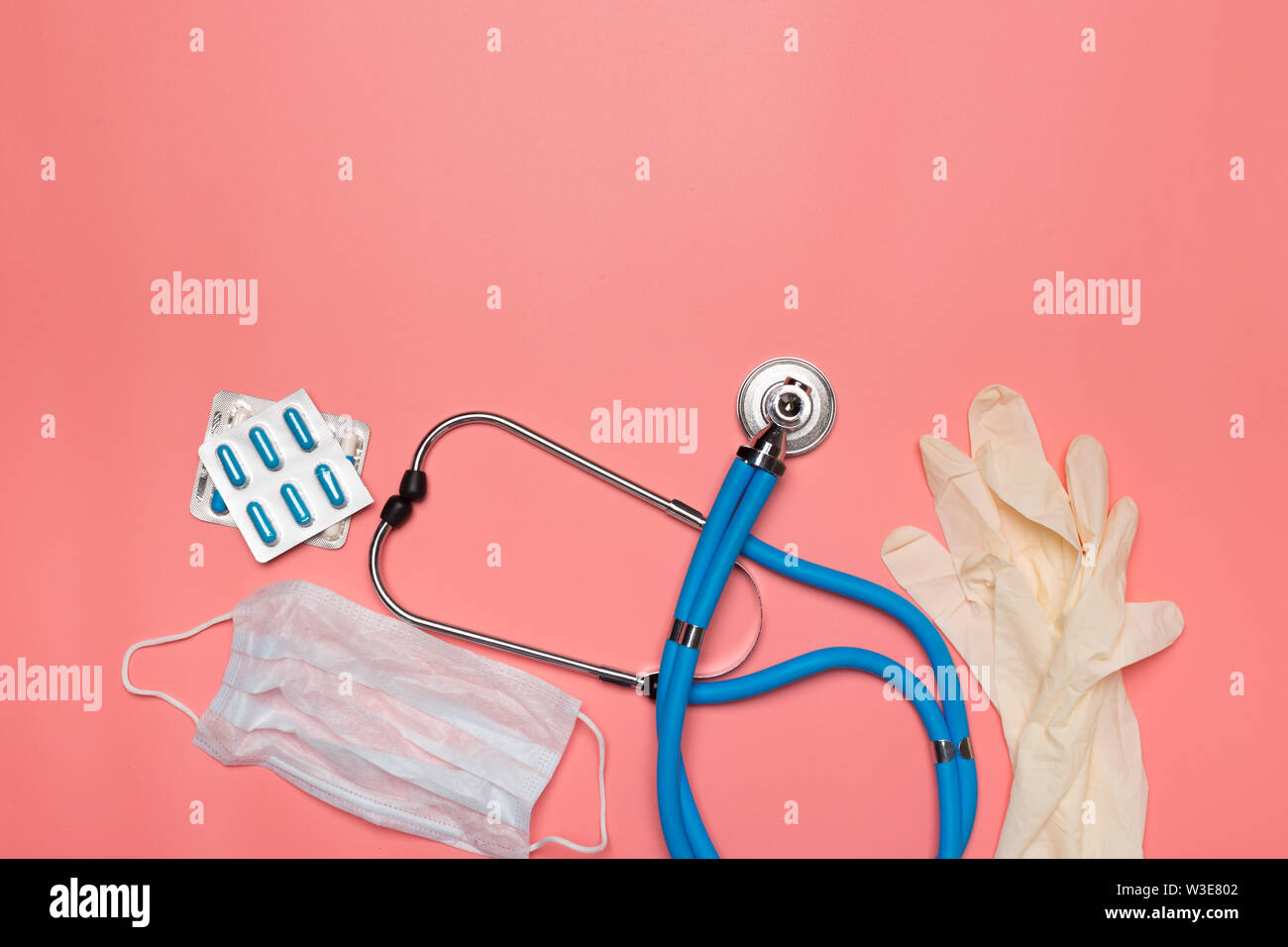 Medical equipment on a pink pastel background Stock Photo - Alamy