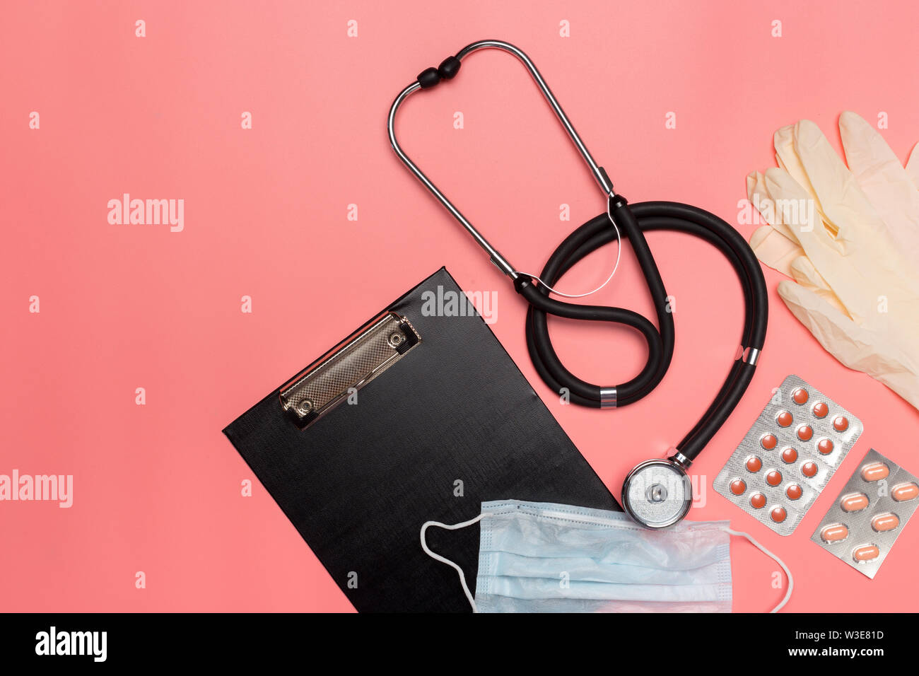 Medical equipment on a pink pastel background Stock Photo - Alamy