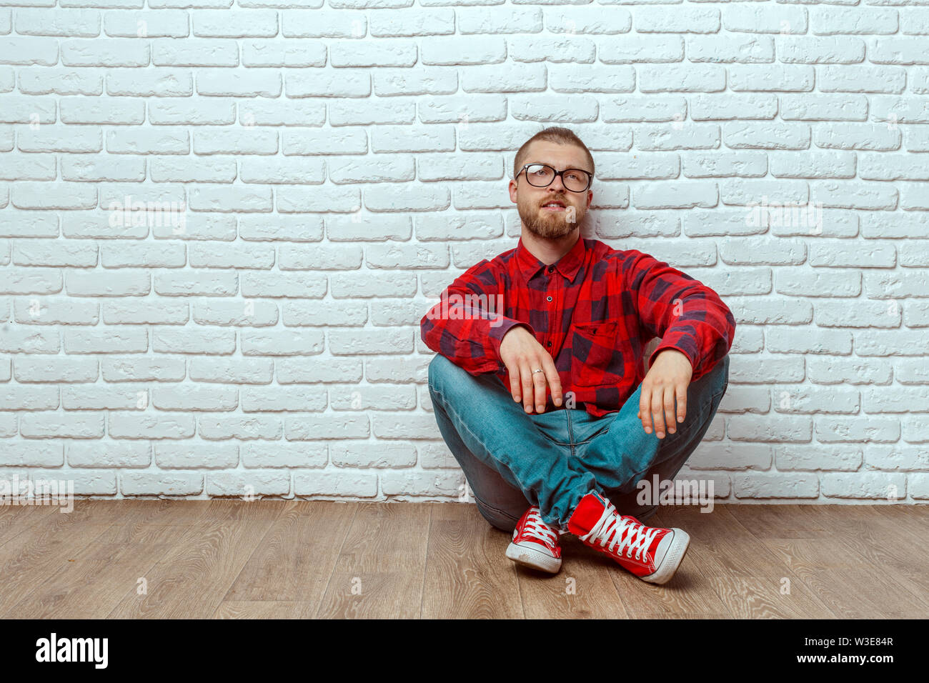 man sitting on floor Stock Photo - Alamy