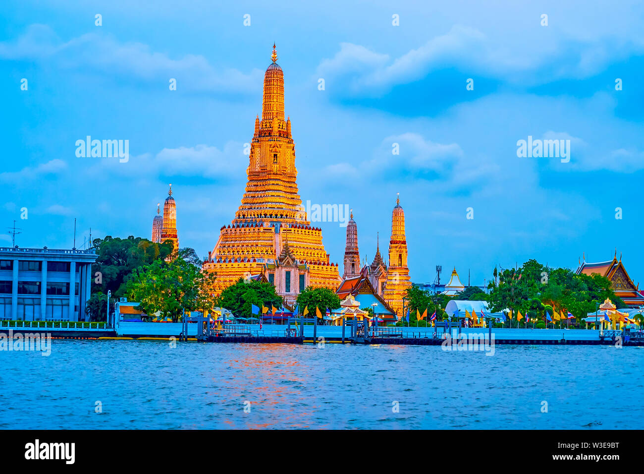 The magnificent Wat Arun temple in evening illumination is one of the ...