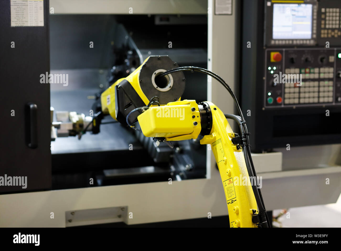 Robot Arm Is Loading Detail Into Cnc Lathe Machine Selective Focus 1942