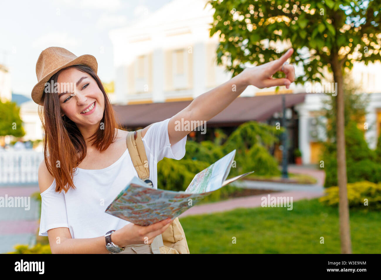 travel guide, tourism in Europe, woman tourist with map on the street ...