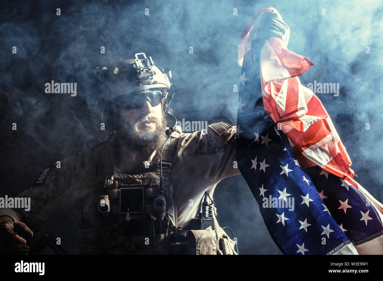 Soldier holding machine gun with national flag Stock Photo - Alamy