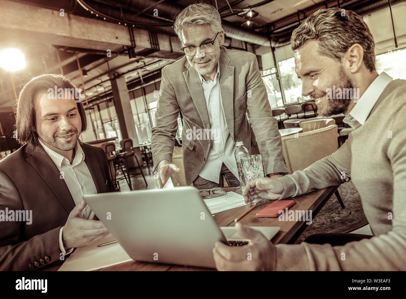 Positive friends working project hi-res stock photography and images ...