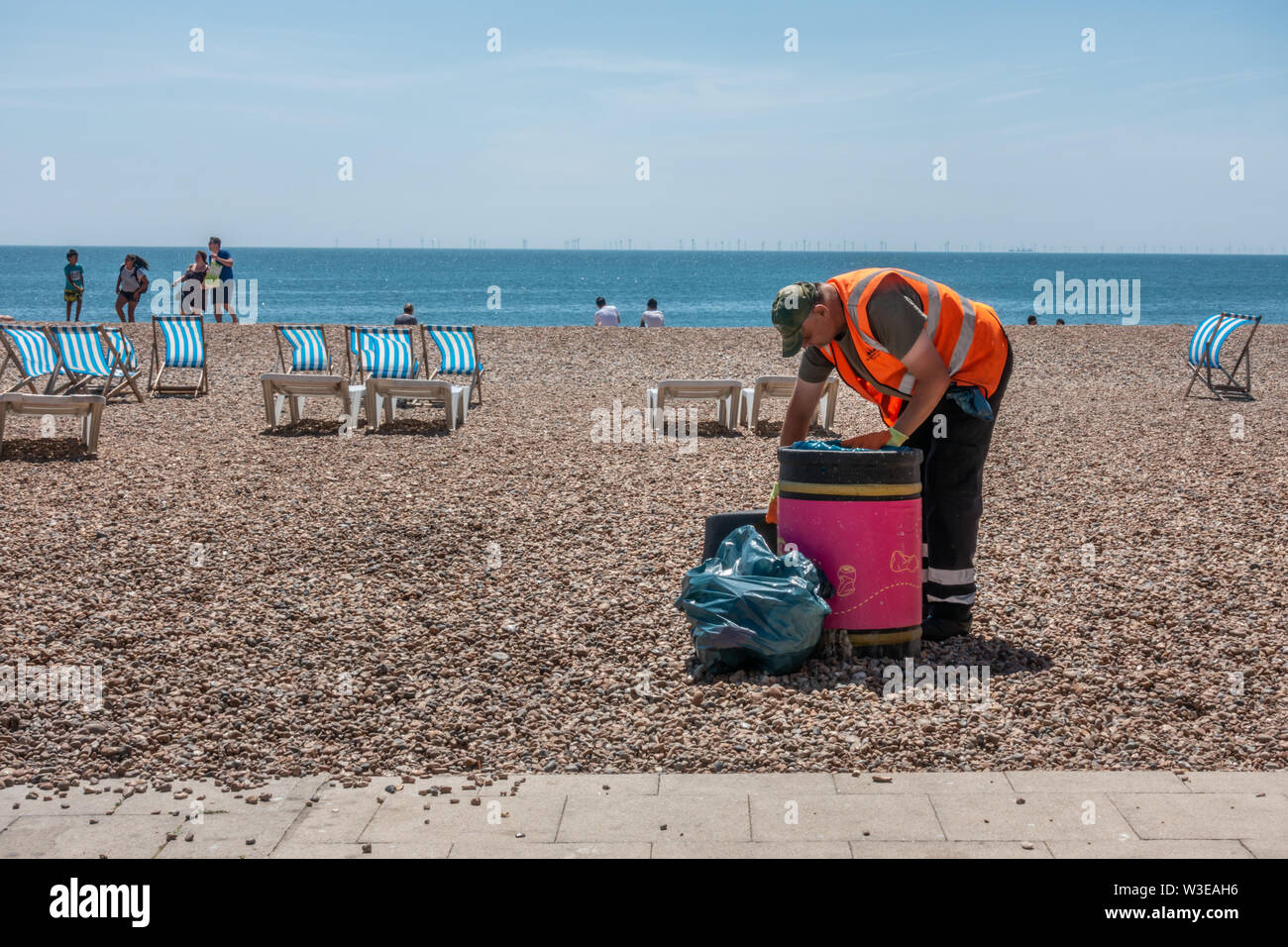 Rubbish collector emptying bins Stock Photo - Alamy