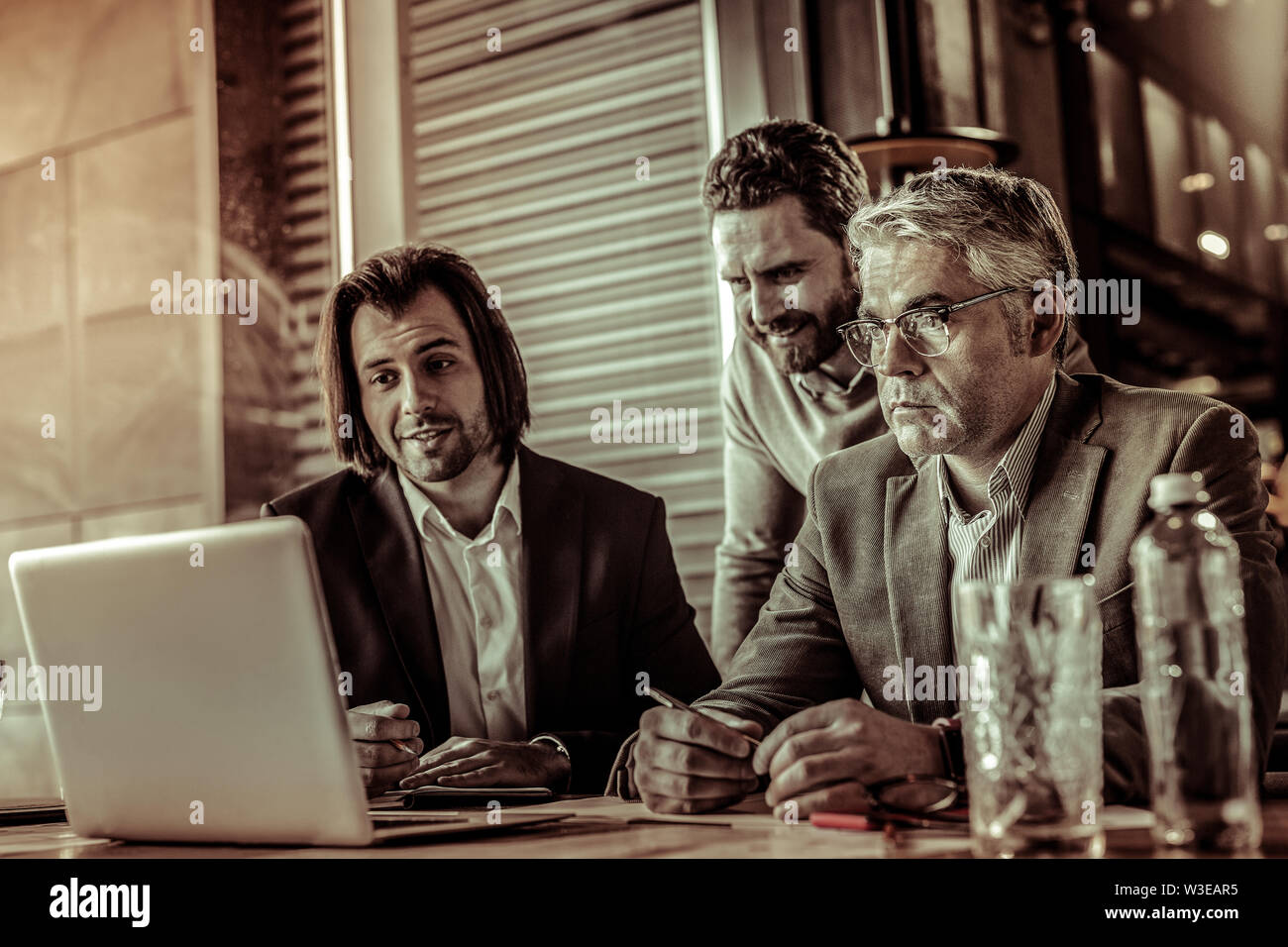 Concentrated male person being deep in thoughts Stock Photo - Alamy