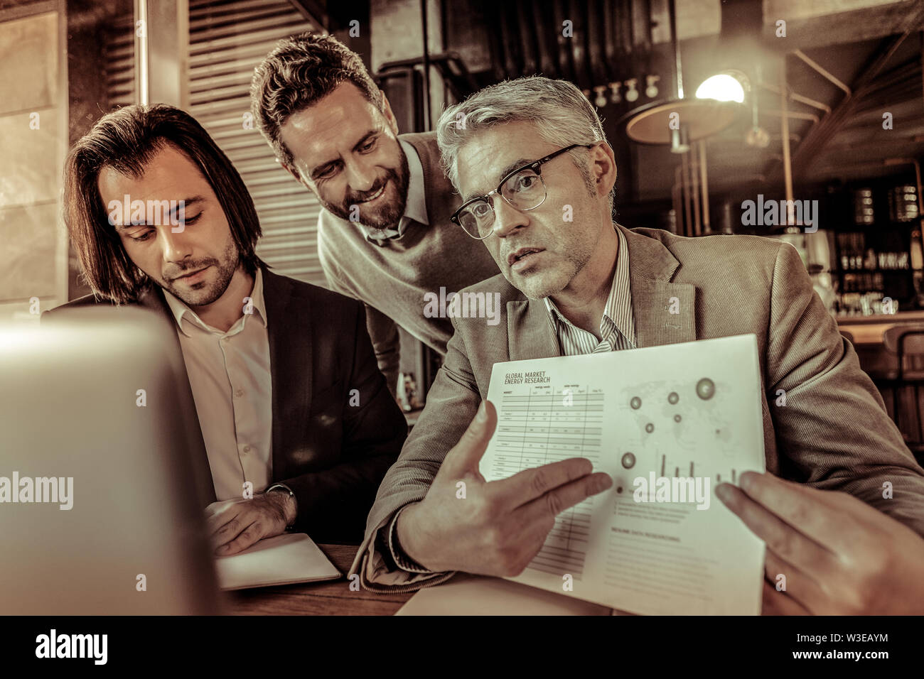 Serious businessman having online conference with colleagues Stock ...