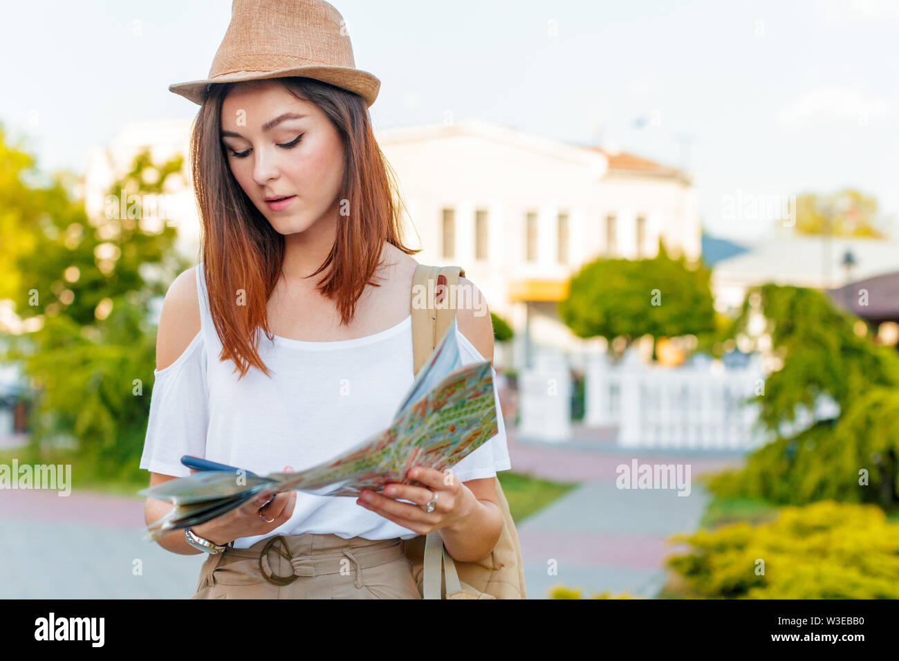 travel guide, tourism in Europe, woman tourist with map on the street ...
