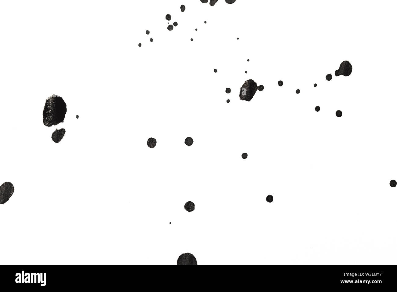 Black ink spatter on white paper hi-res stock photography and images ...