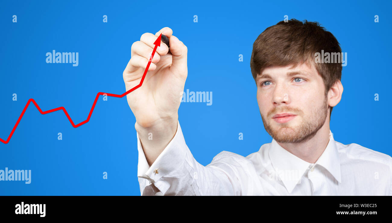 Business man hand drawing a graph Stock Photo - Alamy