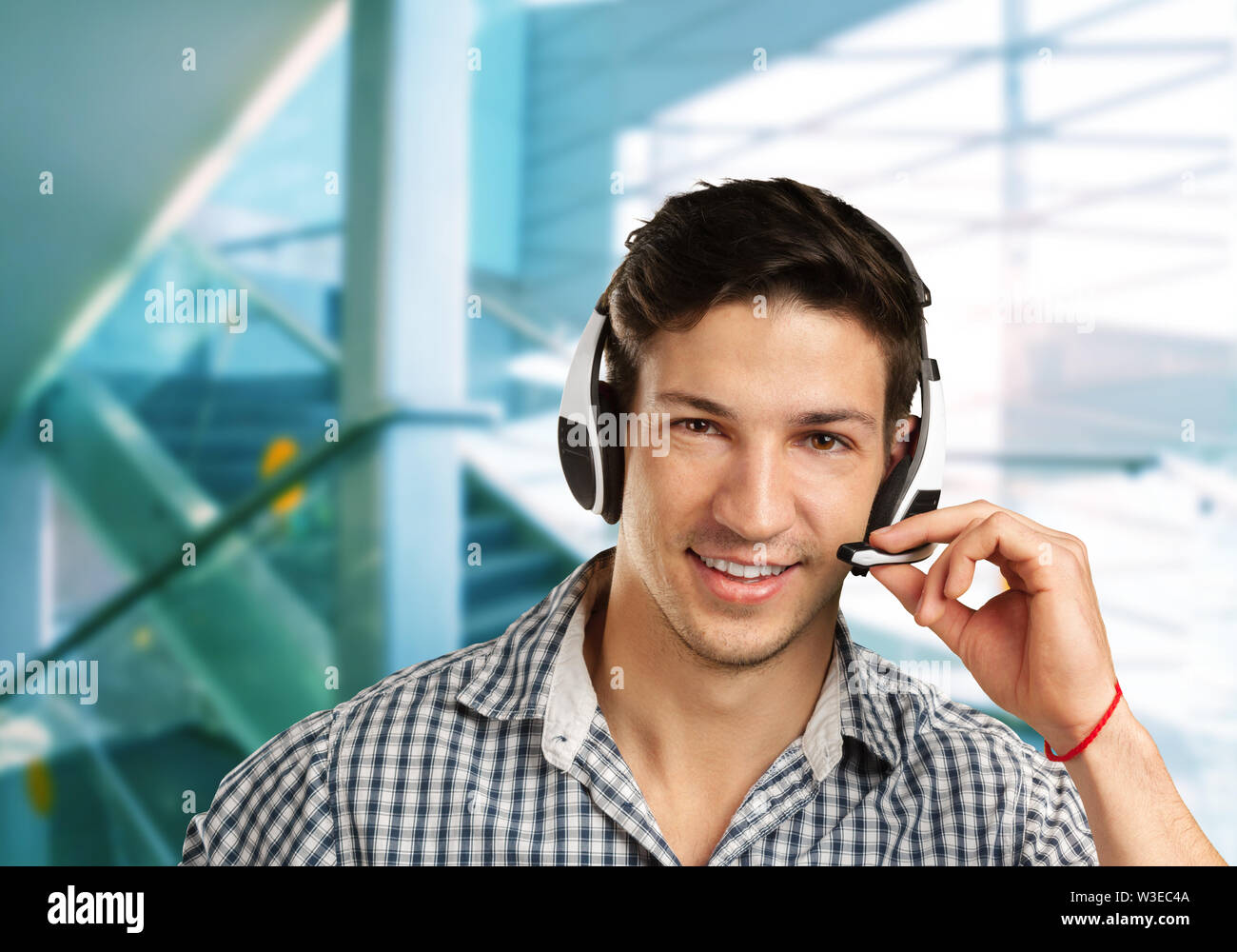 Man call center manager with headset on his head Stock Photo - Alamy