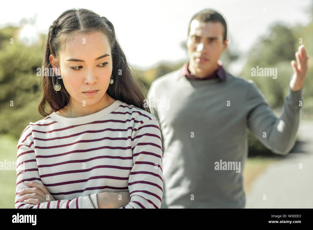 Scandalous short-haired man sorting things out with girlfriend Stock ...