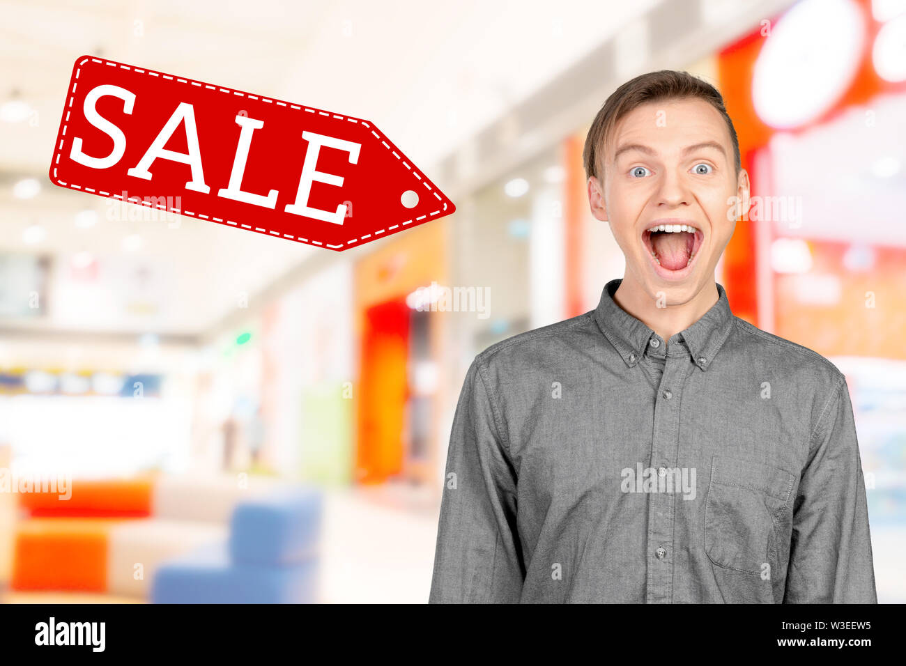Portrait of young man with shocked facial expression Stock Photo - Alamy
