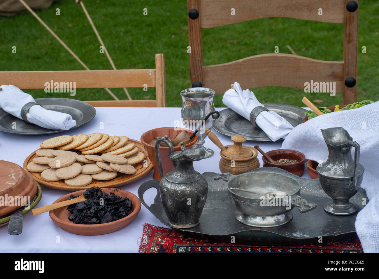 Typical Medieval food table with biscuits and pewter Stock Photo - Alamy