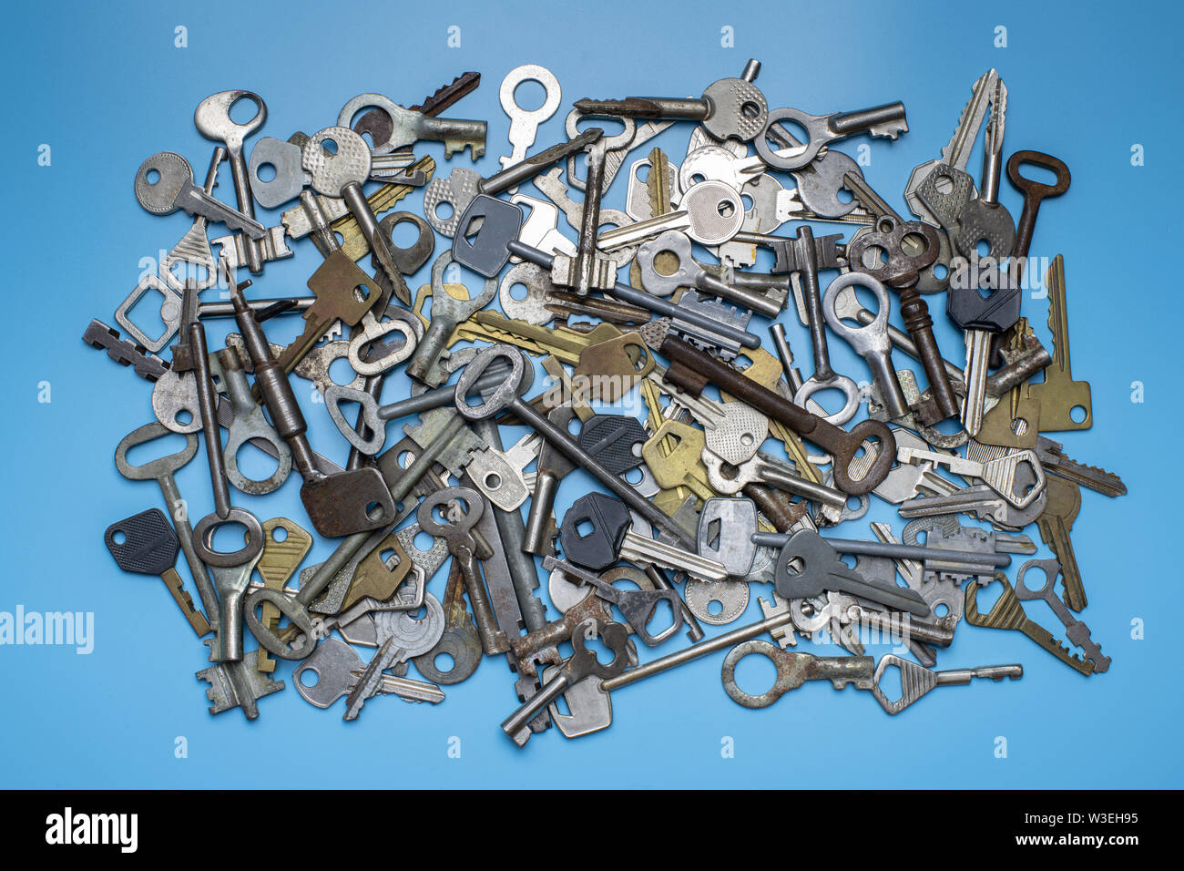 Keys set on blue background. Door lock keys and safes for property ...