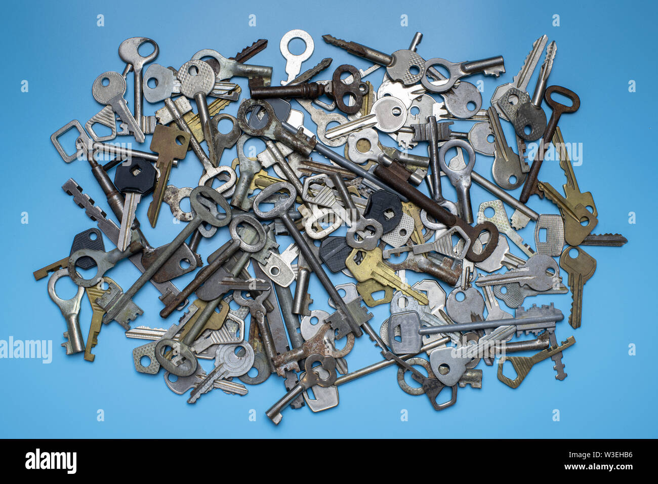 Keys set on blue background. Door lock keys and safes for property ...