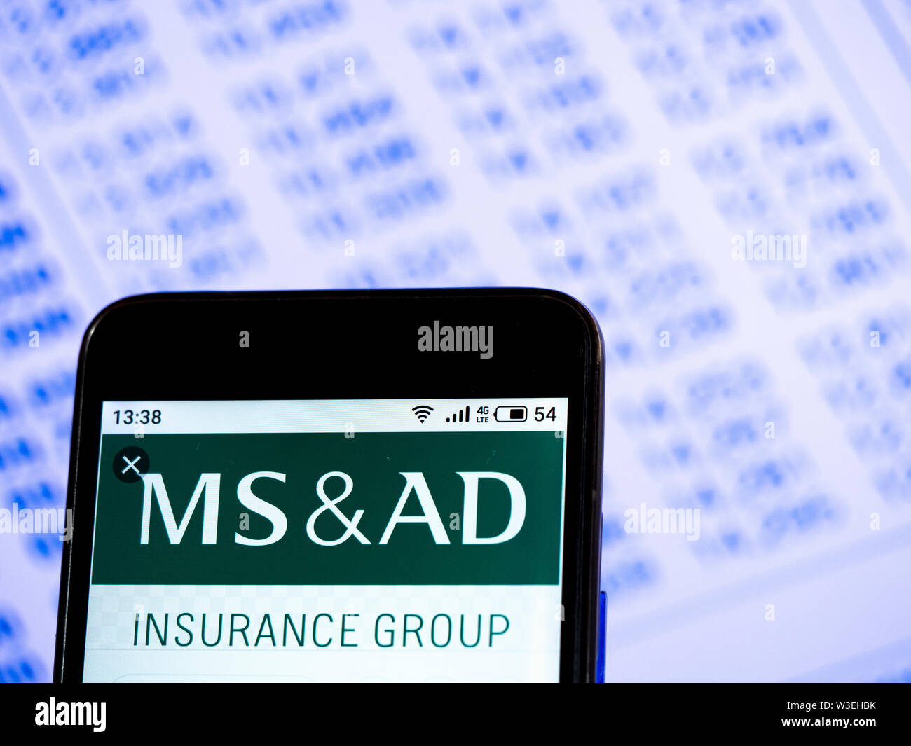 In this photo illustration the MS&AD Insurance Group logo is seen displayed on a smartphone ...