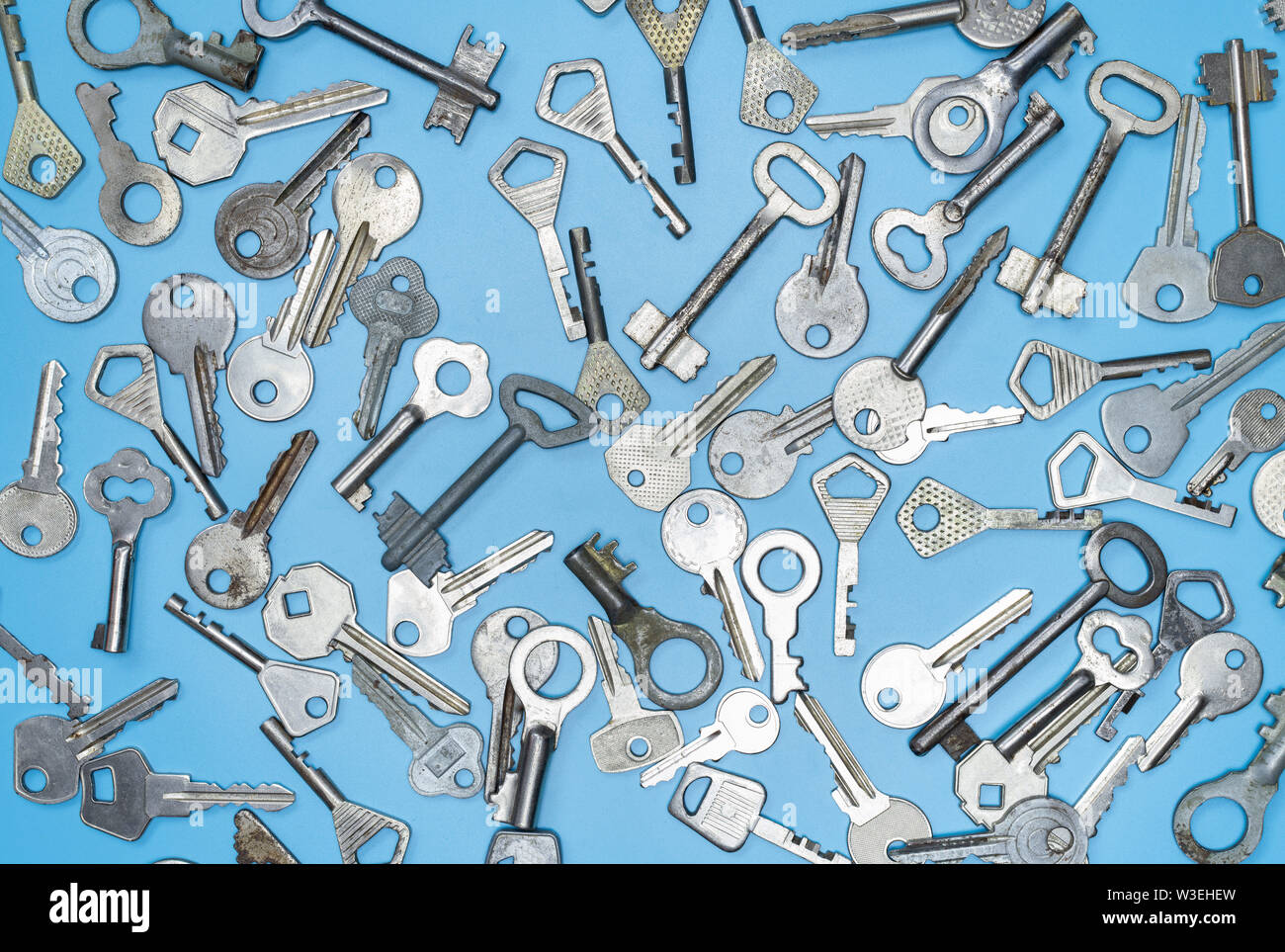 Keys set on blue background. Door lock keys and safes for property ...