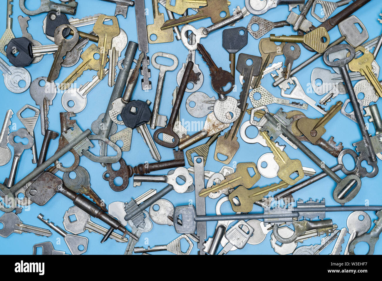 Keys set on blue background. Door lock keys and safes for property ...