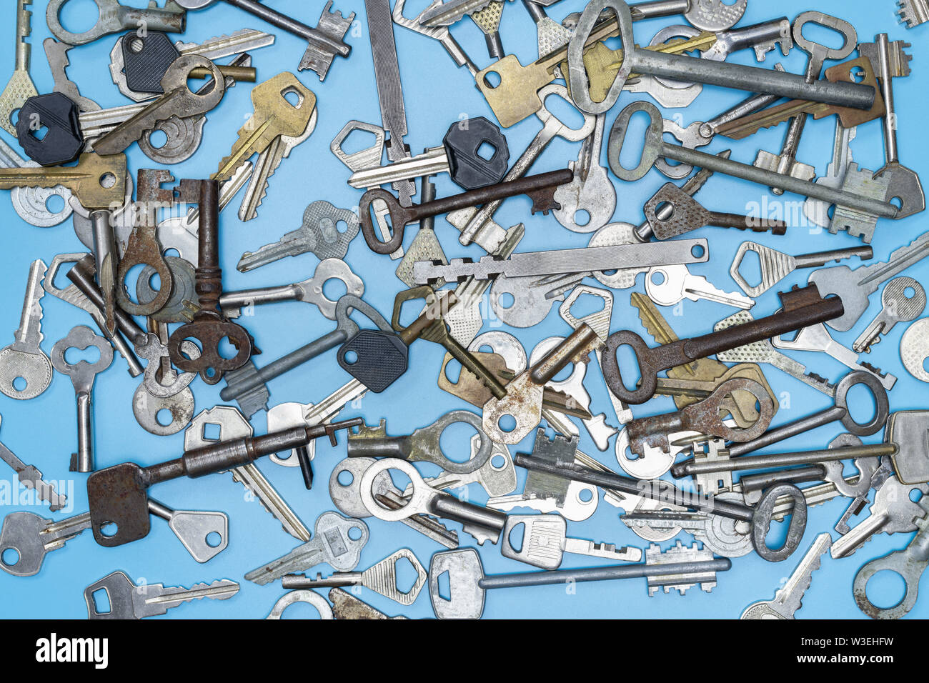 Keys set on blue background. Door lock keys and safes for property ...