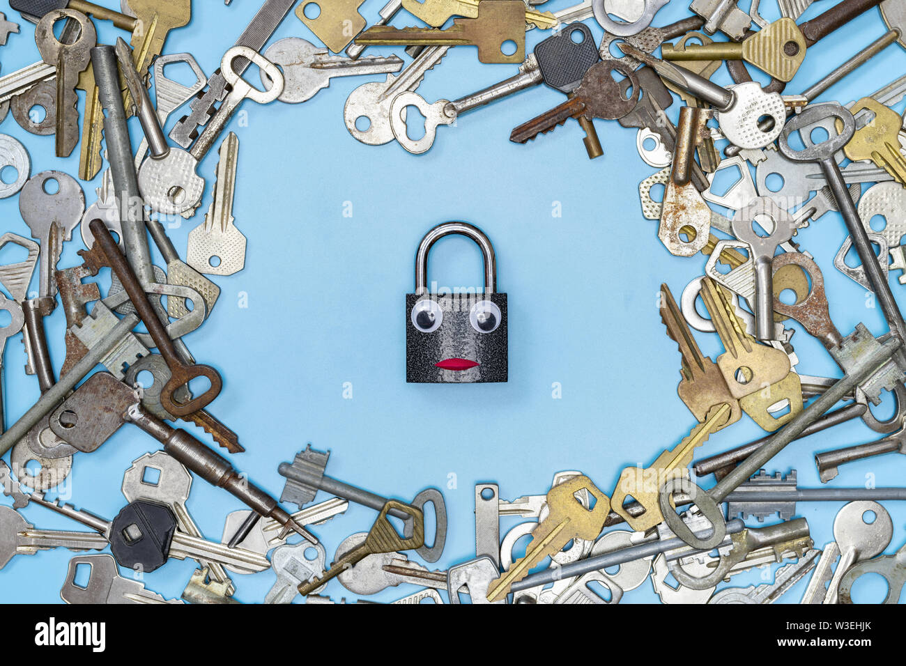 Keys set with funny lock in middle concept, blue background. Choosing ...