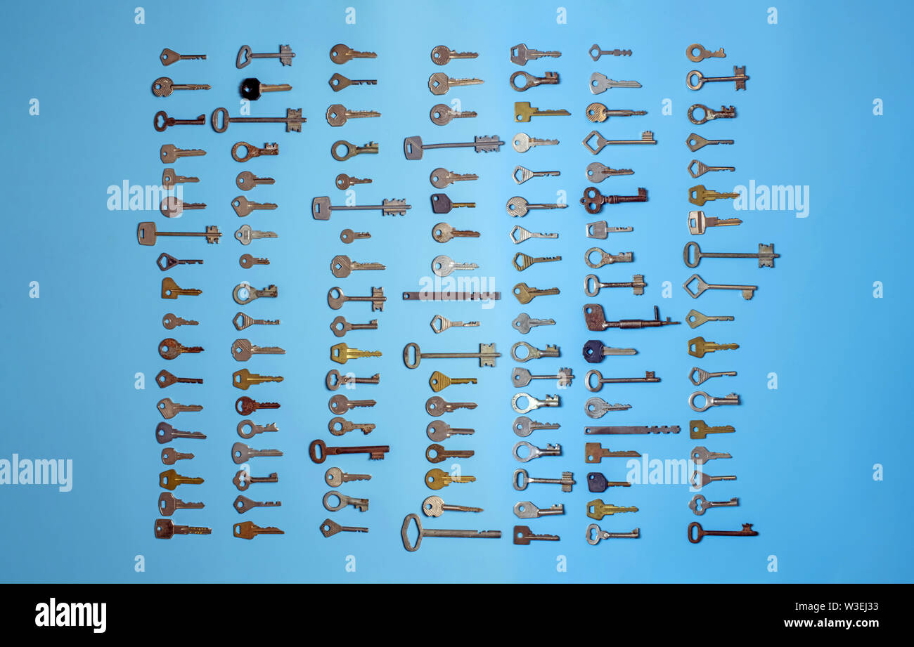 Keys set on blue background. Door lock keys and safes for property ...