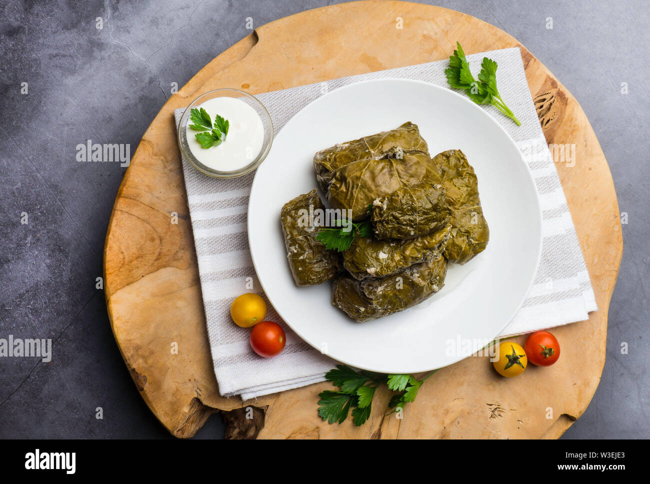 Traditional georgian dolma in grape leaves with parsley, cream ...
