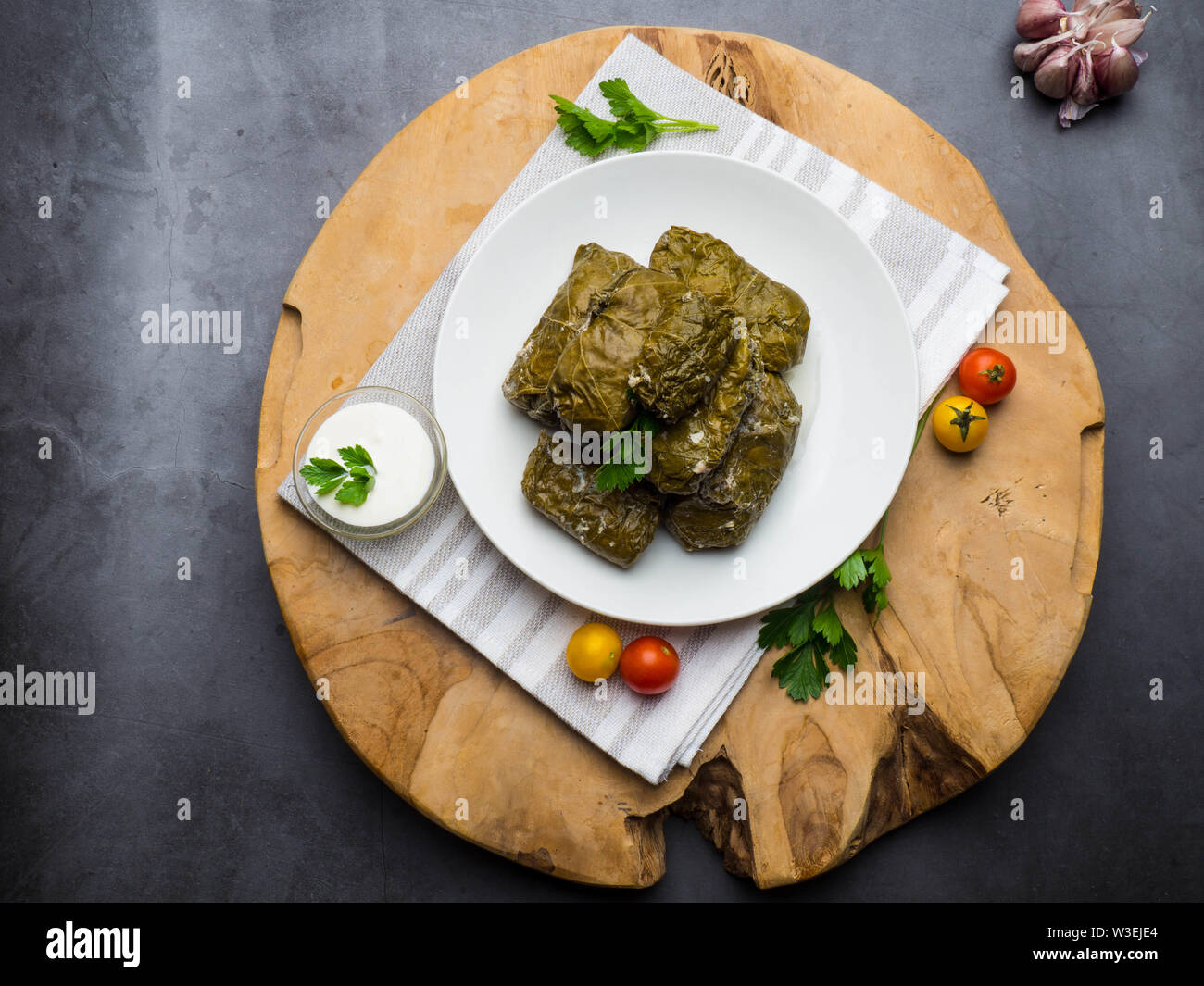 Traditional georgian dolma in grape leaves with parsley, cream ...
