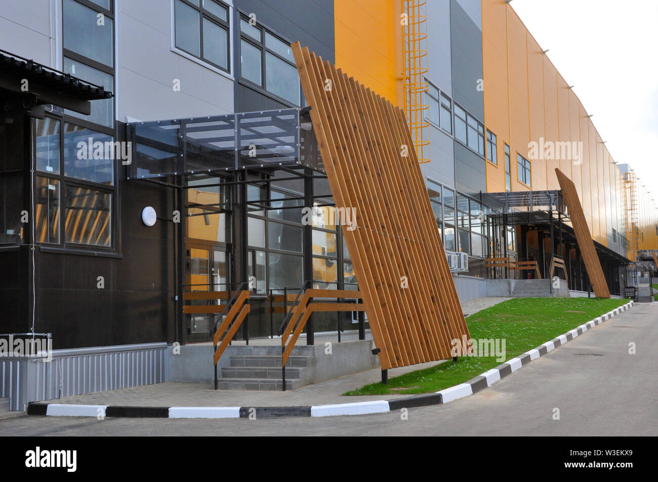 A Large distribution warehouse with gates for loading goods. Staff ...